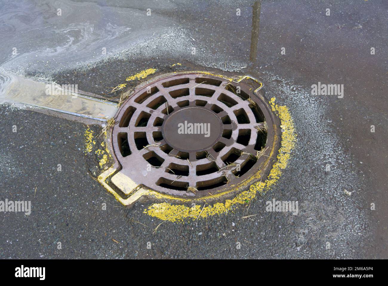 Cast-iron manhole cover storm sewer in the park close-up Stock Photo ...