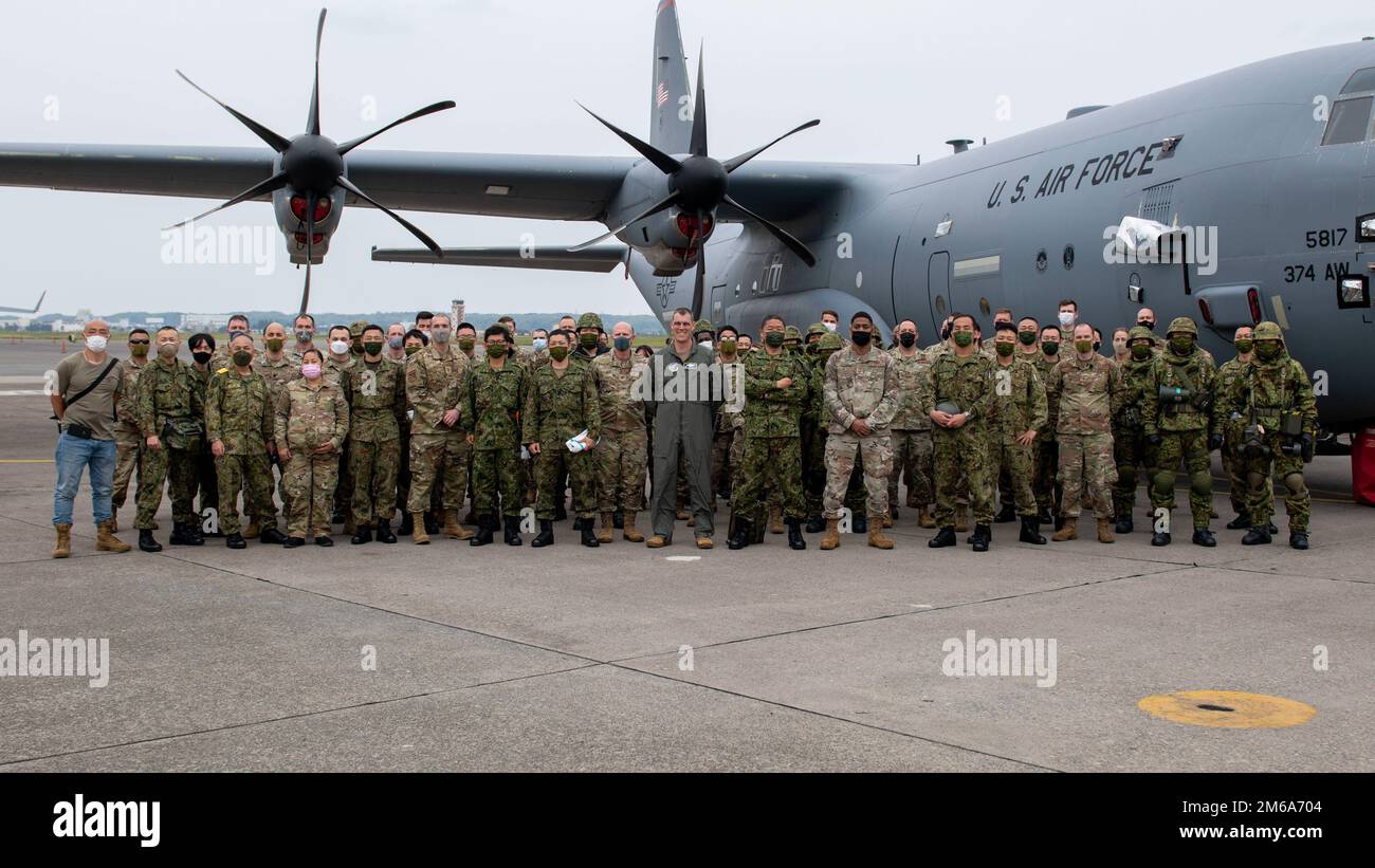 U.S. Air Force and Japan Ground Self-Defense Force members pose for a ...