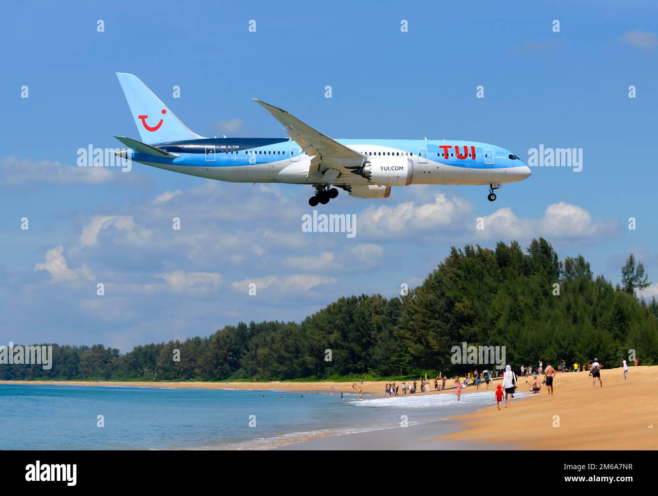 TUI Airways Boeing 787 airplane over Mai Khao Beach near Phuket Airport ...