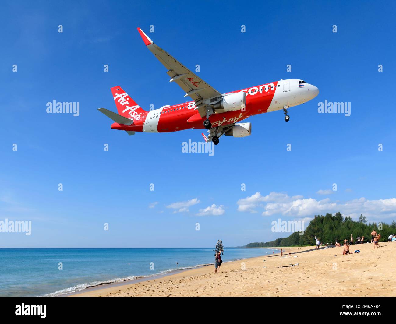 Thai Air Asia Airbus A320 airplane over Mai Khao Beach before landing ...