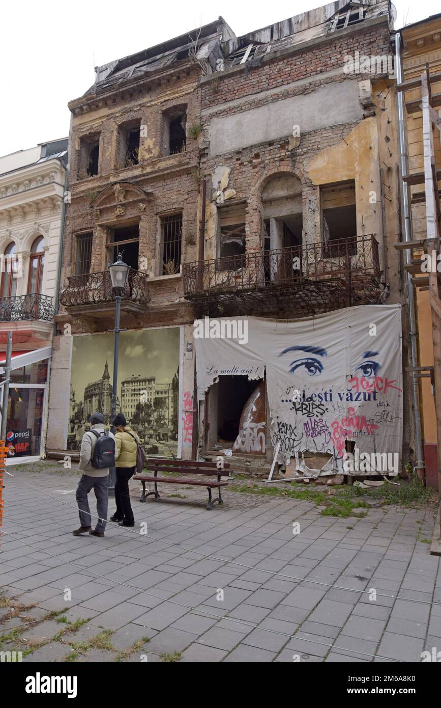 A derelict ruined empty stone built house with balcony in Bucharest ...