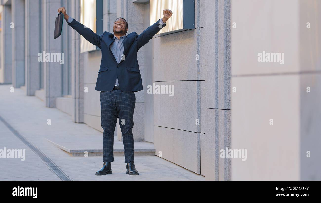 Overjoyed happy success African American man worker manager intern ...