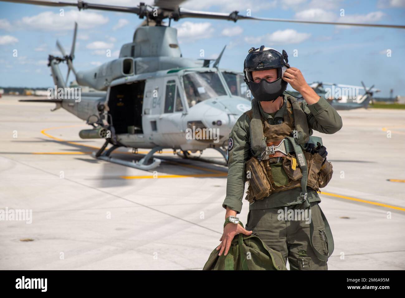 A U.S. Marine Corp Pilot adjusts his headgear during a live display of ...