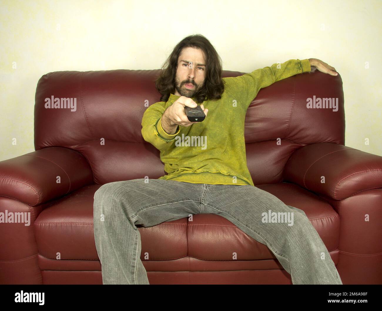 Male lying couch remote hi-res stock photography and images - Alamy