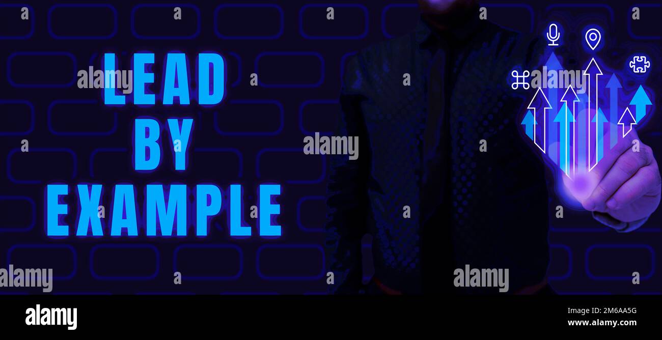 Hand writing sign Lead By Example, Business approach Be a mentor leader ...