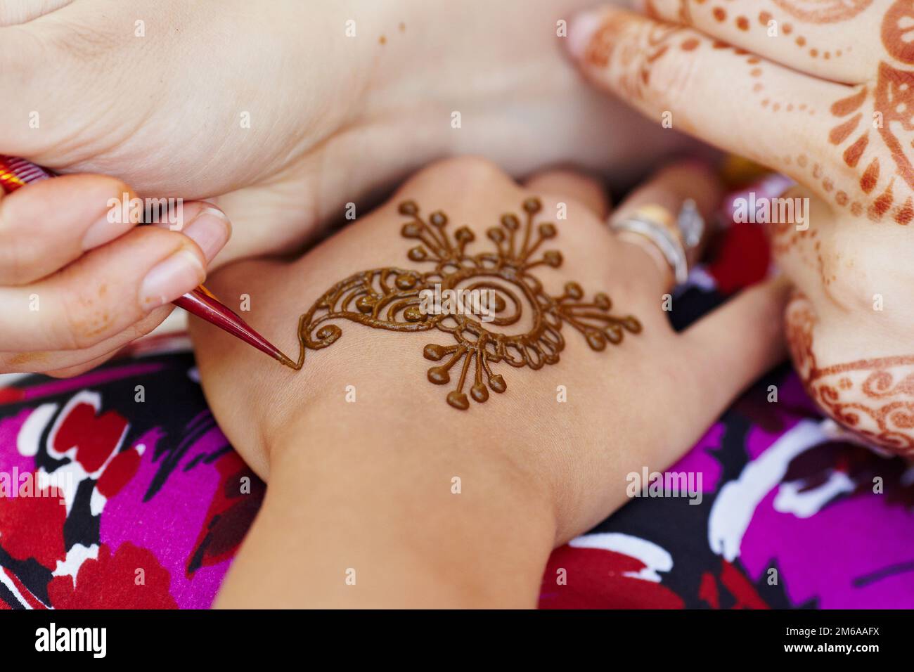 Henna art on woman's hand Stock Photo - Alamy