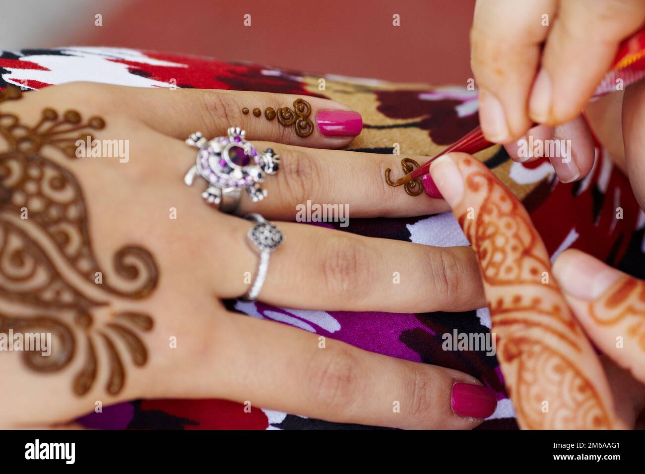 Henna art on woman's hand Stock Photo - Alamy