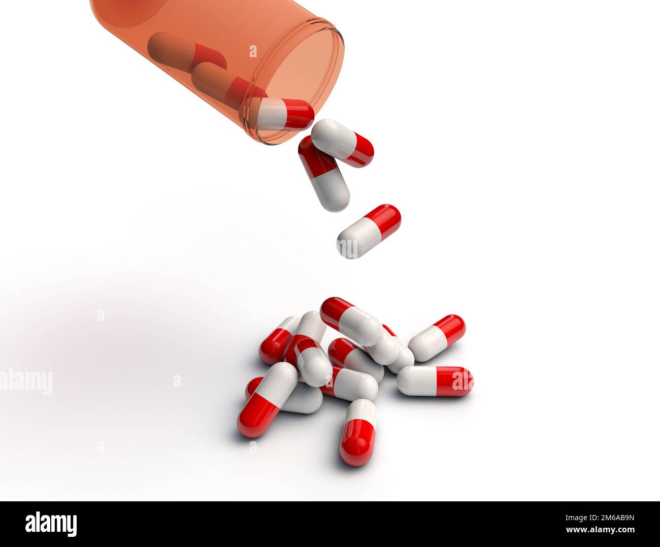 Spilled capsules from a container Stock Photo - Alamy