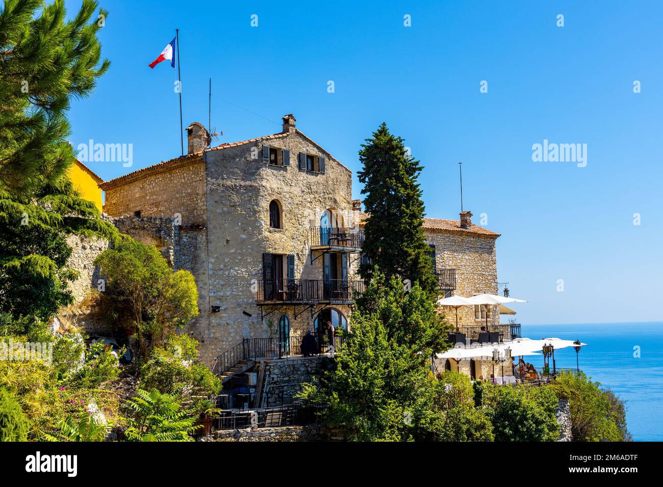Eze, France - August 1, 2022: Chateau Eza hotel on slope of medieval ...