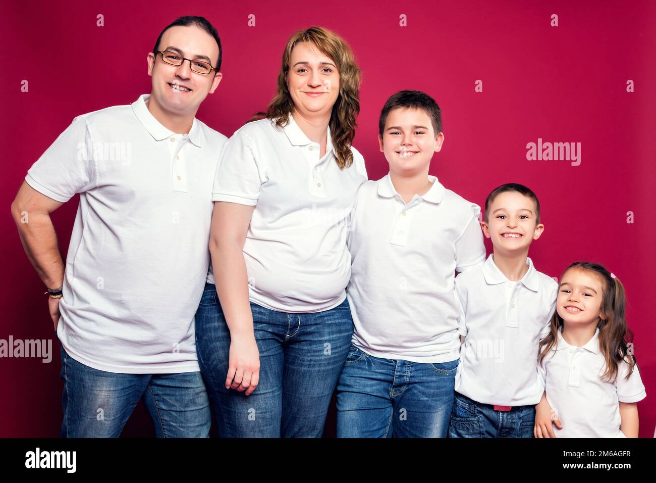 Five Member Family Smiling Stock Photo - Alamy