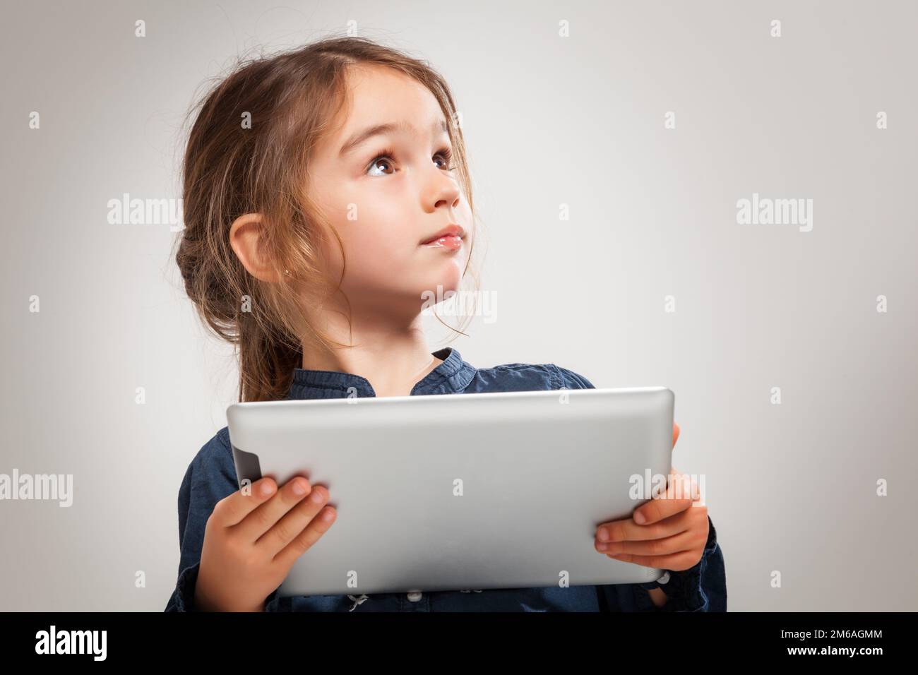 Child using device hi-res stock photography and images - Alamy