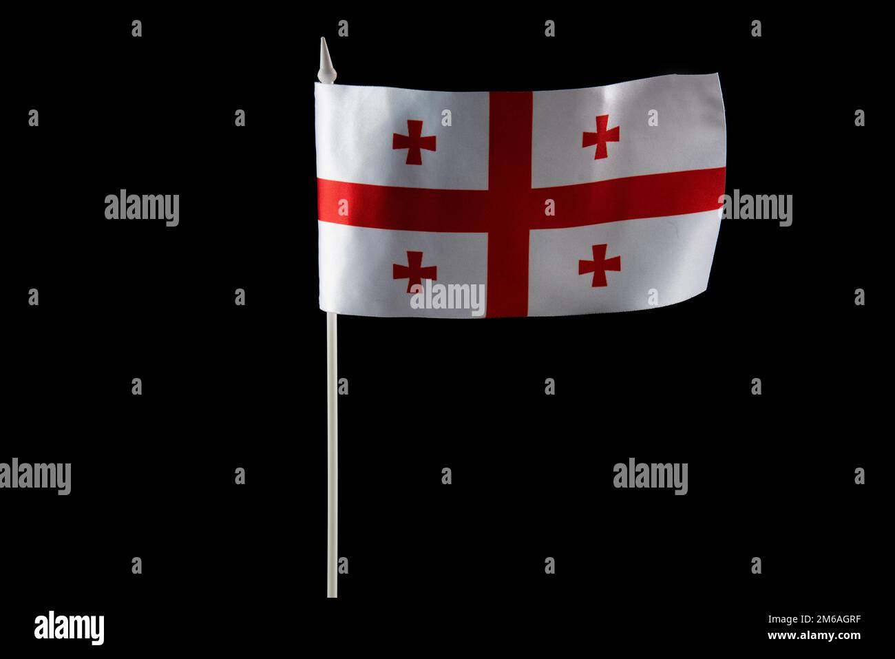 Small national flag of the Georgia on a black background Stock Photo ...