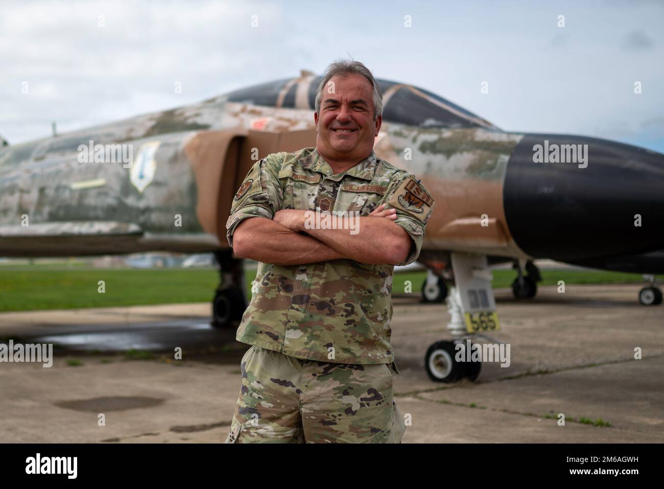 U.S. Air Force Senior Master Sgt. Terry Parr stands in front of an F-4 ...