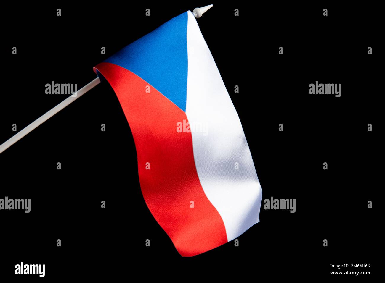 The Czech flag on a black background is developing and flying in the ...
