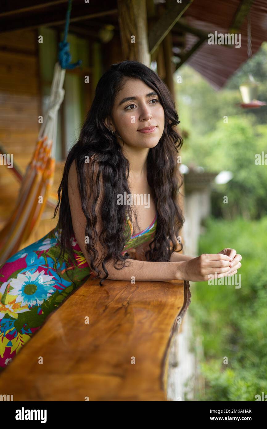 details of a young woman with long hair, latin model wearing a colorful ...