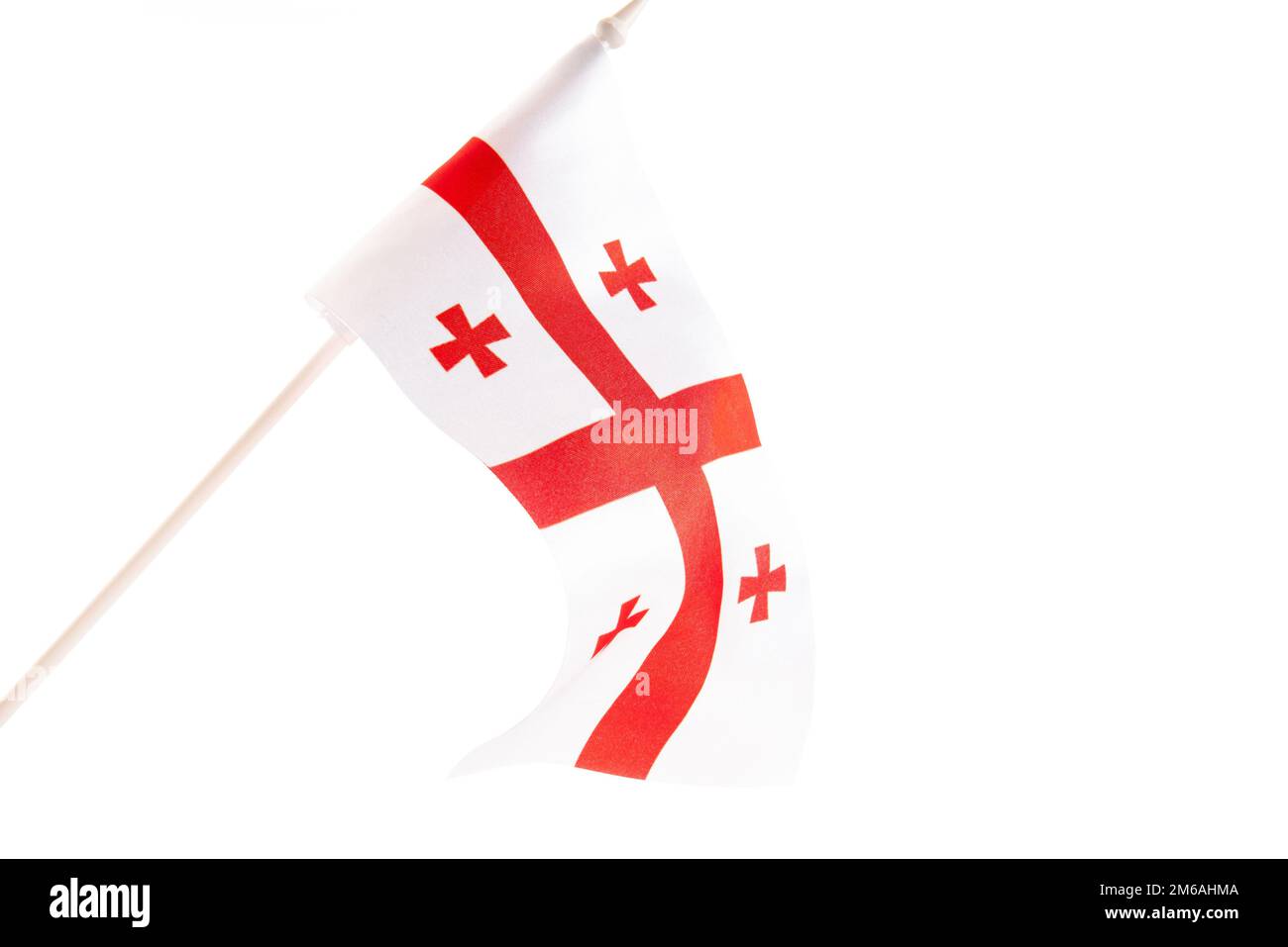 The Flag Of Georgia On A Black Background Develops And Flies Waving In