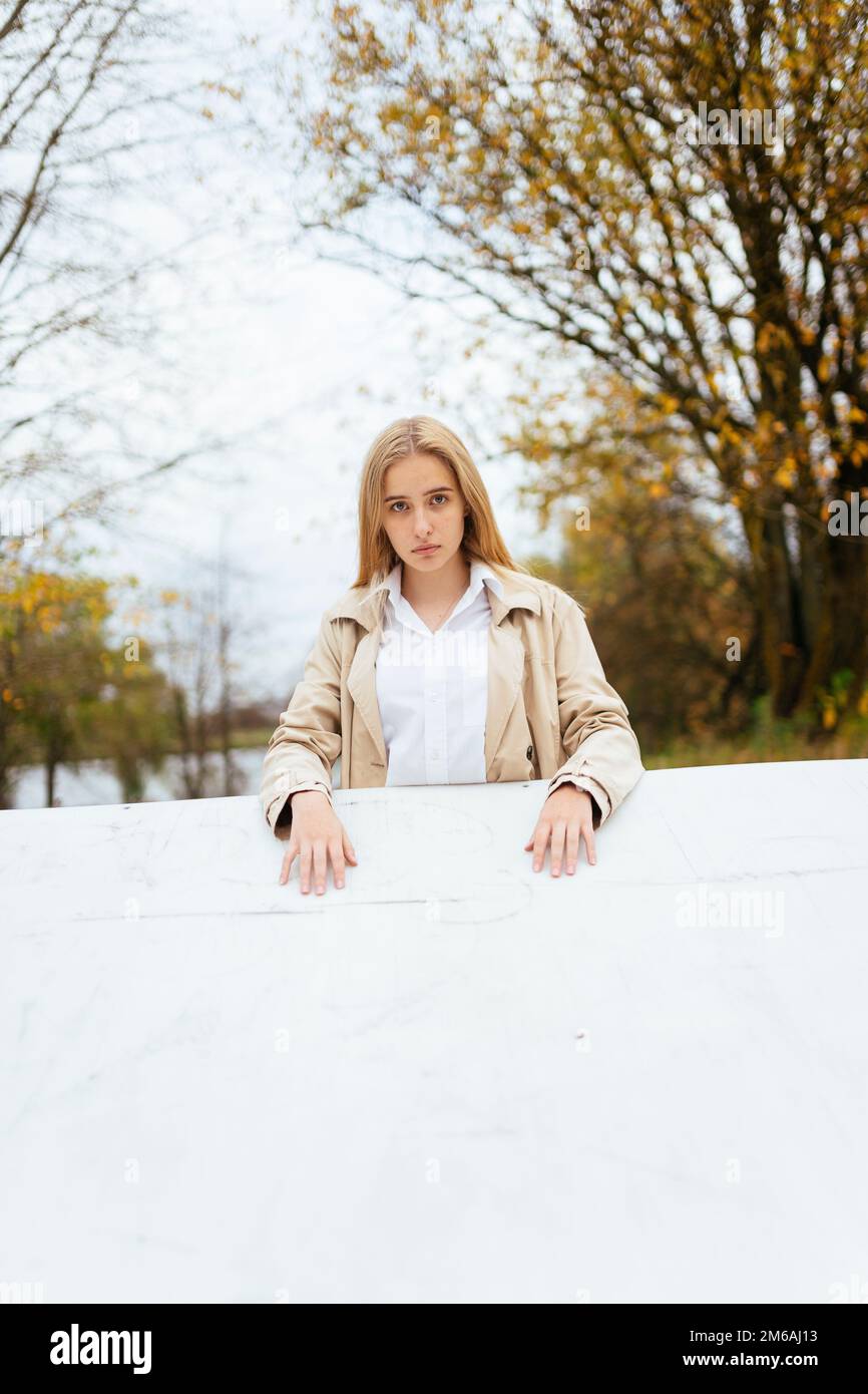 portrait of a young woman in autumn pulling her hands forward Stock ...
