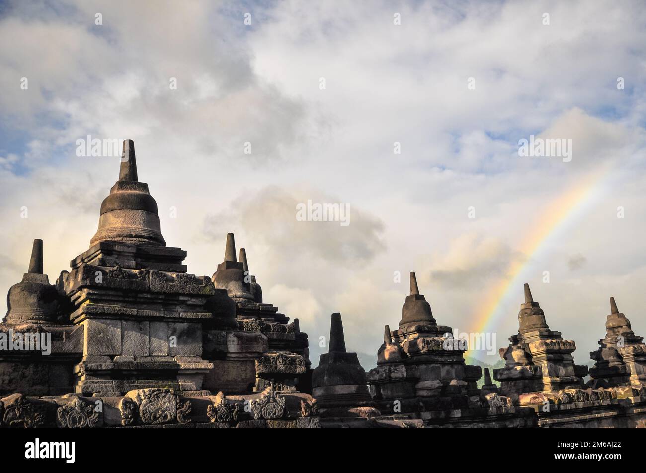 Rainbow over Stupa Buddist temple Borobudur complex in Yogjakarta in ...