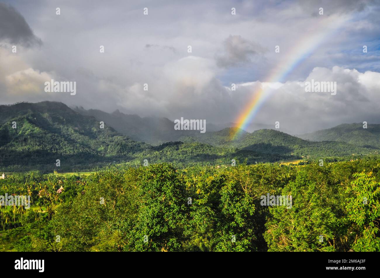 Rainbow in jungle Borobudur complex in Yogjakarta in Java Stock Photo ...