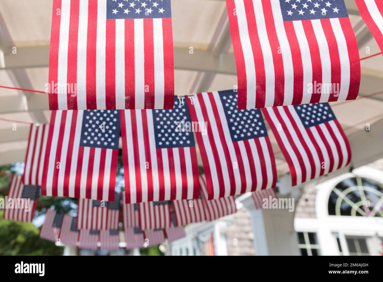 strings of American flags hanging as fourth of July party decor Stock ...