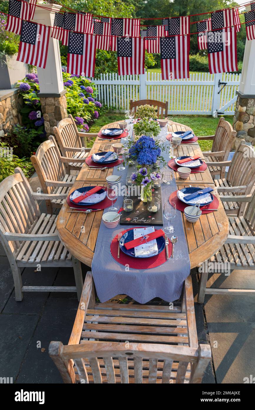 Festive Fourth of July party table set under garden pergola Stock Photo ...