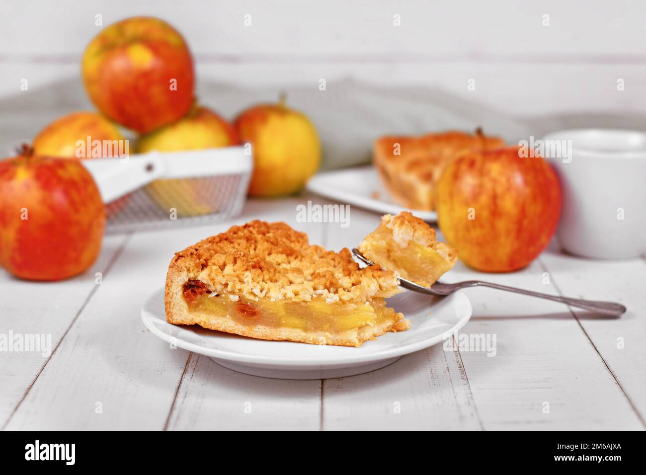 Slice of traditional European apple pie with topping crumbles called ...