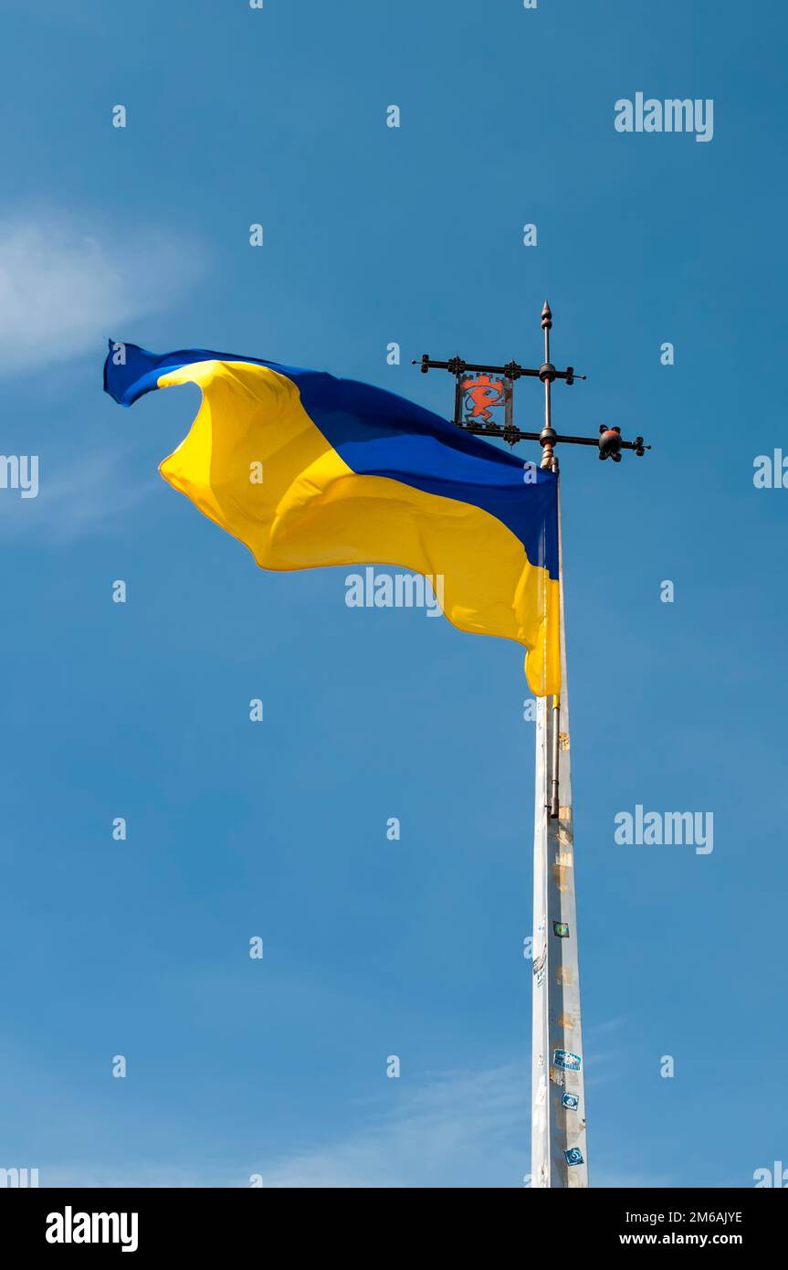 Flag of Ukraine with the coat of arms of Lviv on a background of blue ...