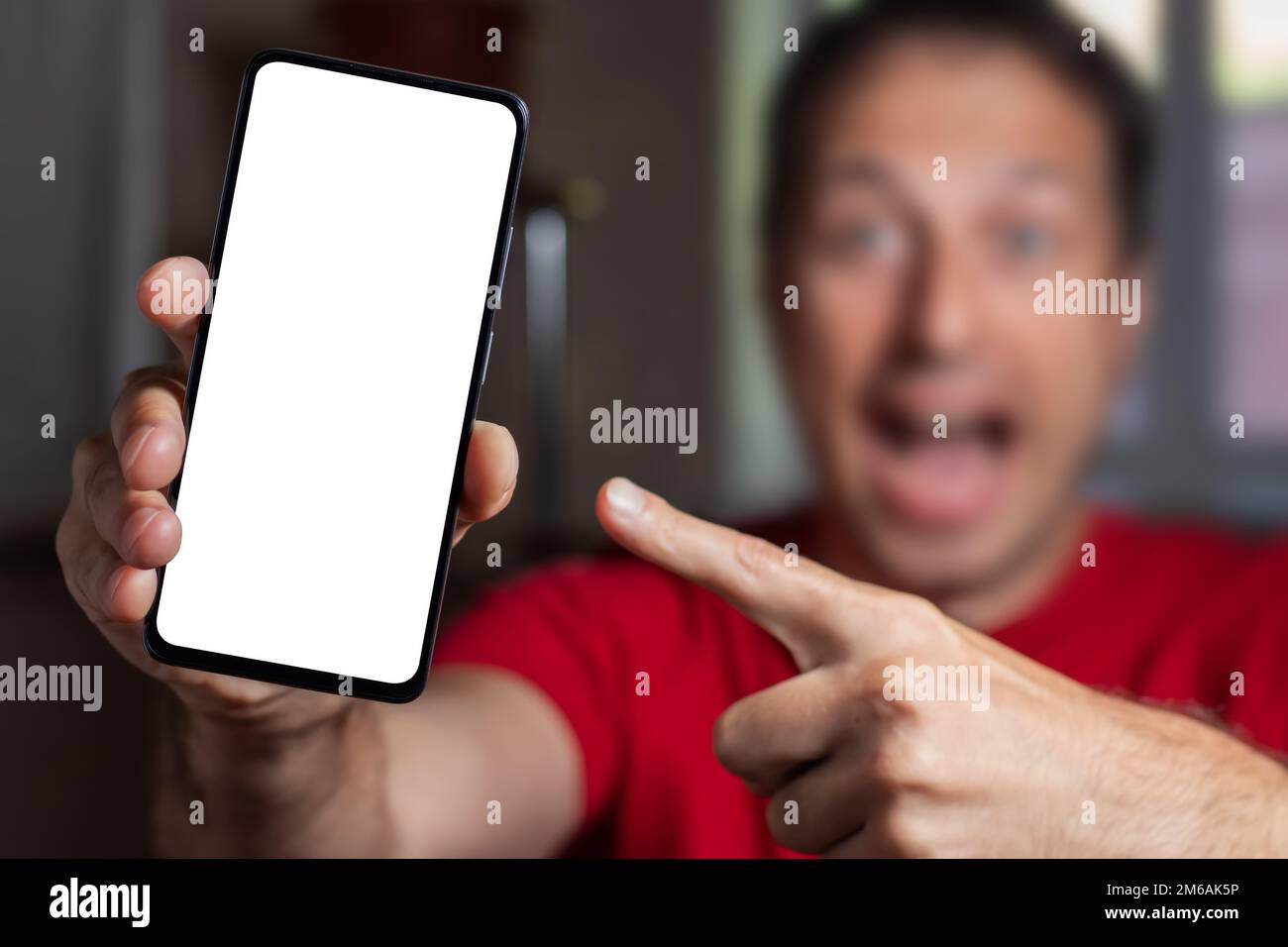 Recommendation. Portrait of excited guy holding big smartphone with ...