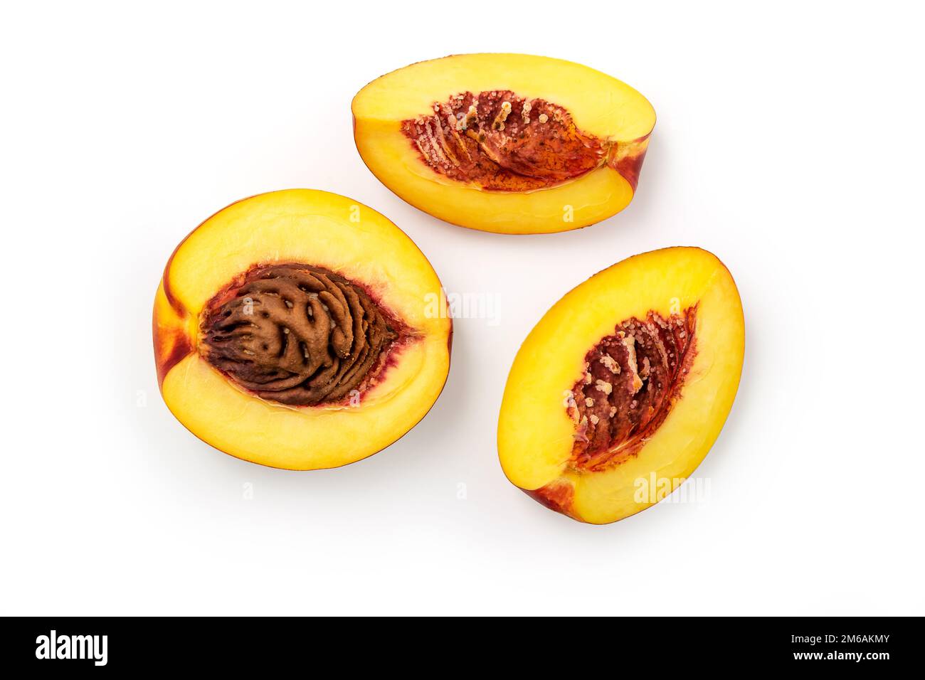 Peach cut in half and quarters isolated on white with clipping path ...