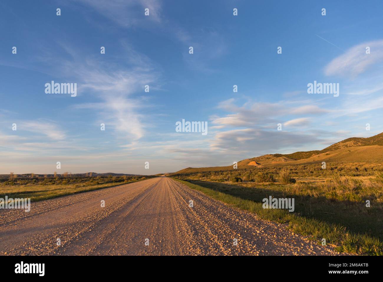 Long empty dirt road in the country Stock Photo - Alamy
