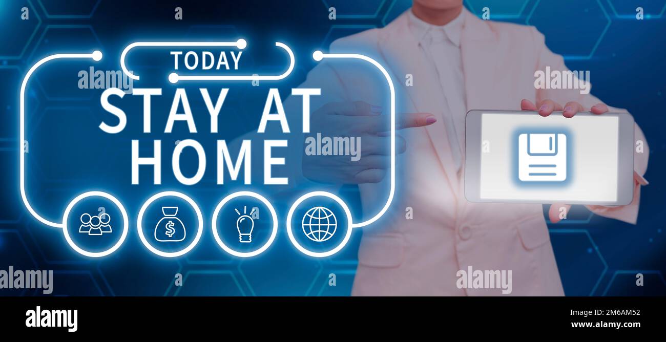 Text sign showing Stay At Home. Conceptual photo movement control ...