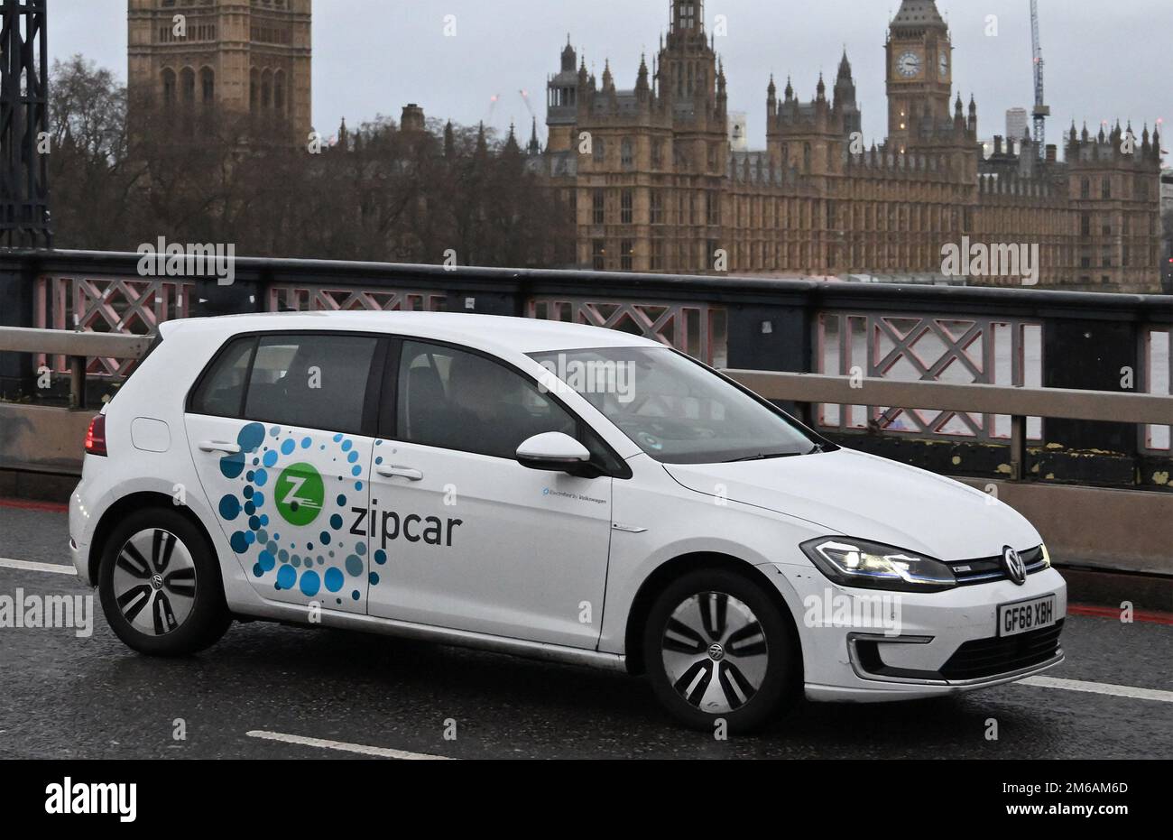 Zip car crosses Lambeth Bridge. Houses of Parliament and Big Ben in the ...