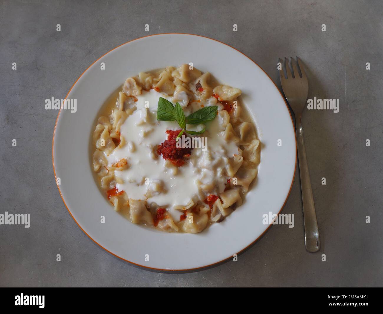 Famous Turkish food manti on the table. Close-up of handmade manti ...