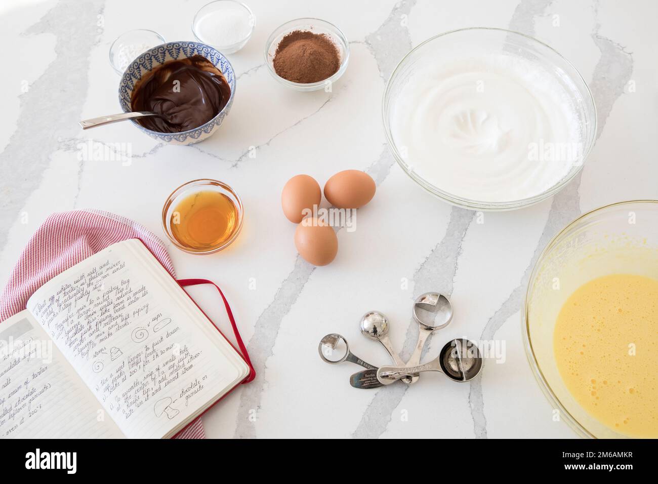 Baking Ingredients and recipe book on a white countertop Stock Photo ...
