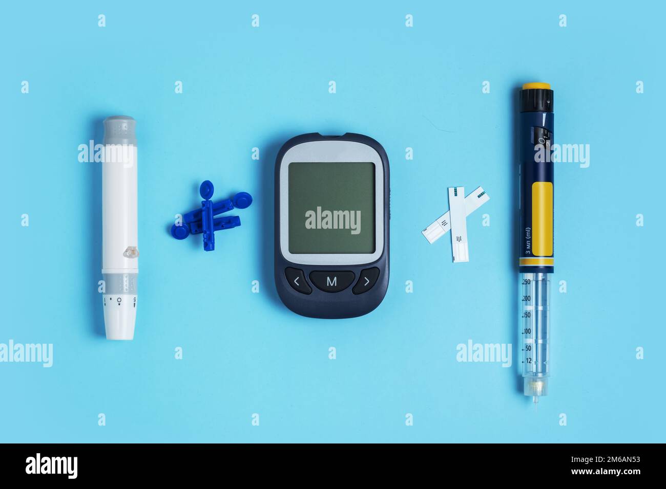 Measuring blood sugar. Glucometer, insulin pen, lancet and test strip ...