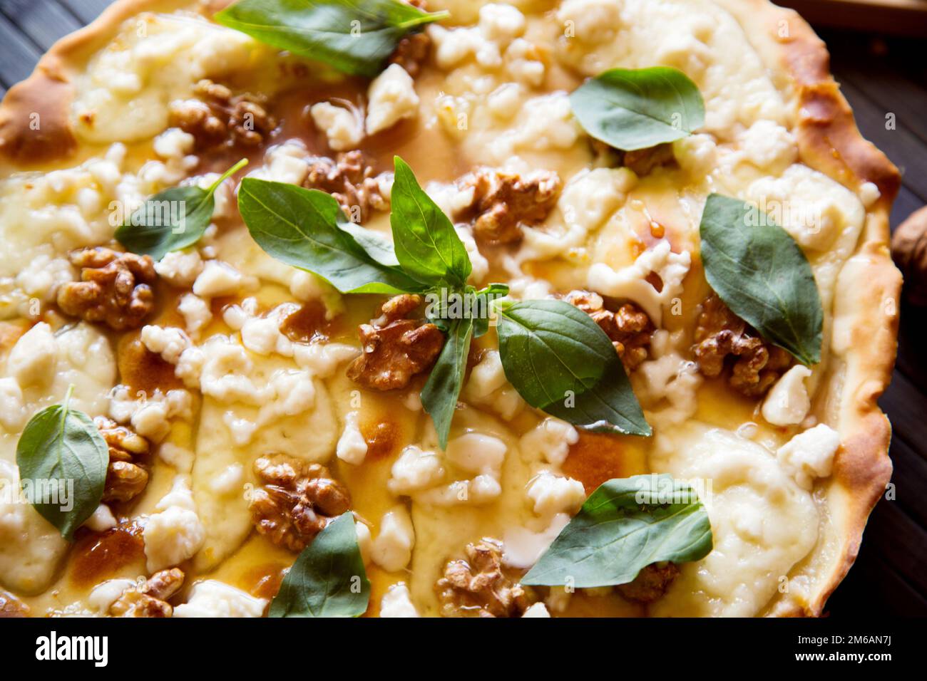 Sweet pizza with fresh cheese, nuts and honey. Neapolitan pizza made ...