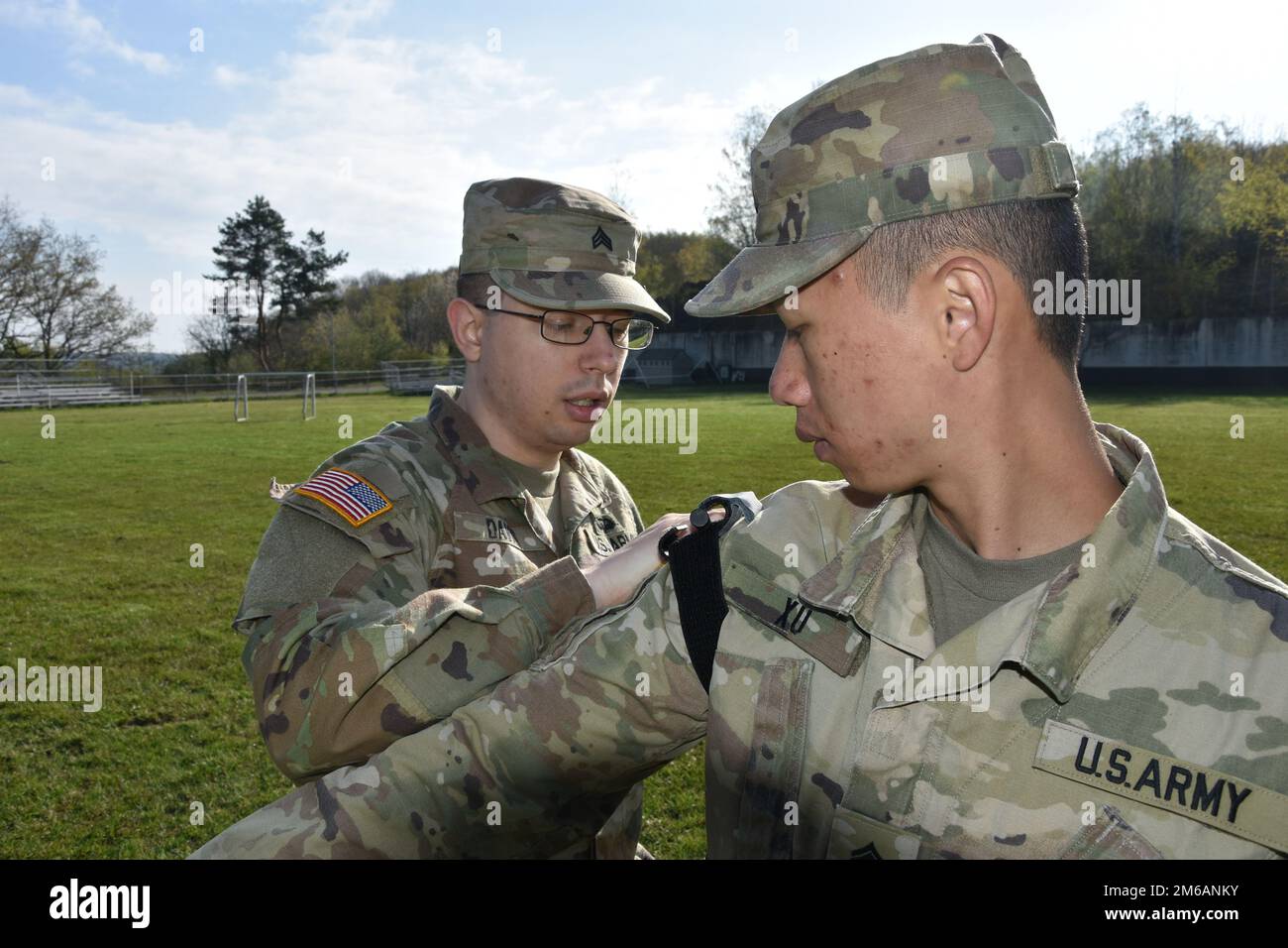 Sgt. Jacob Davis (left) and Staff Sgt. Yaozhuo Xu show U.S. Army NATO ...