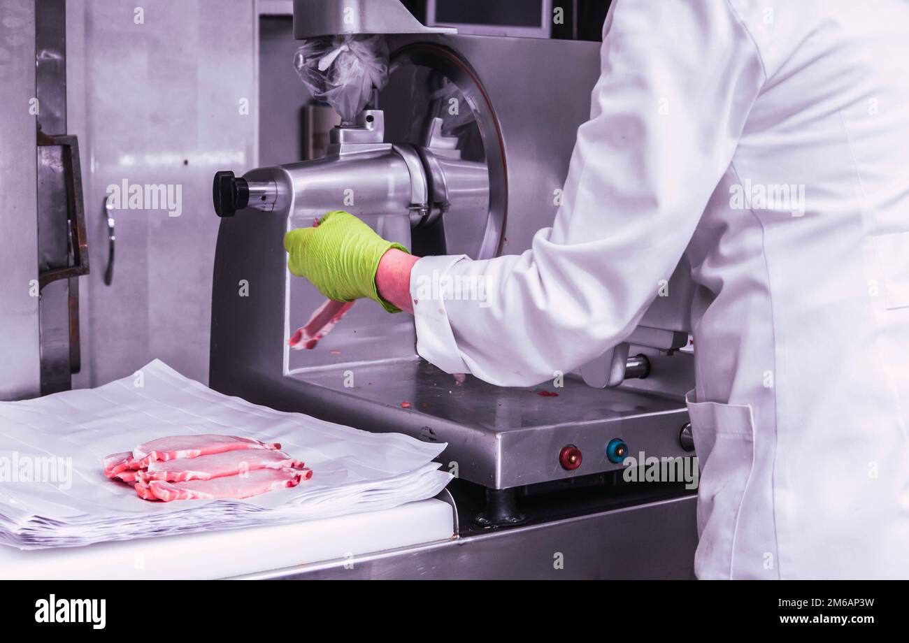 butcher cutting steaks with the steak knife Stock Photo - Alamy