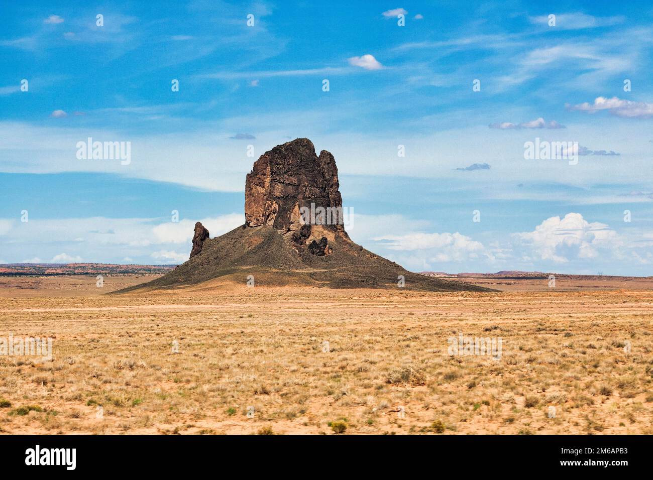 Eroded volcano El Capitan on a plateau, Agathla Peak, Kayenta, Navajo ...