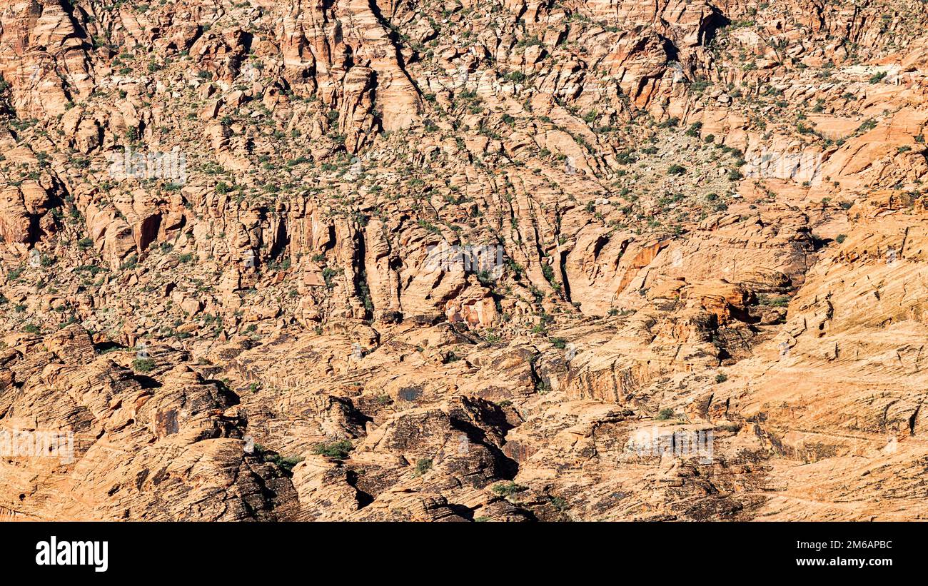 Sandstone rock face sculpted by wind and water, Snow Canyon State Park ...