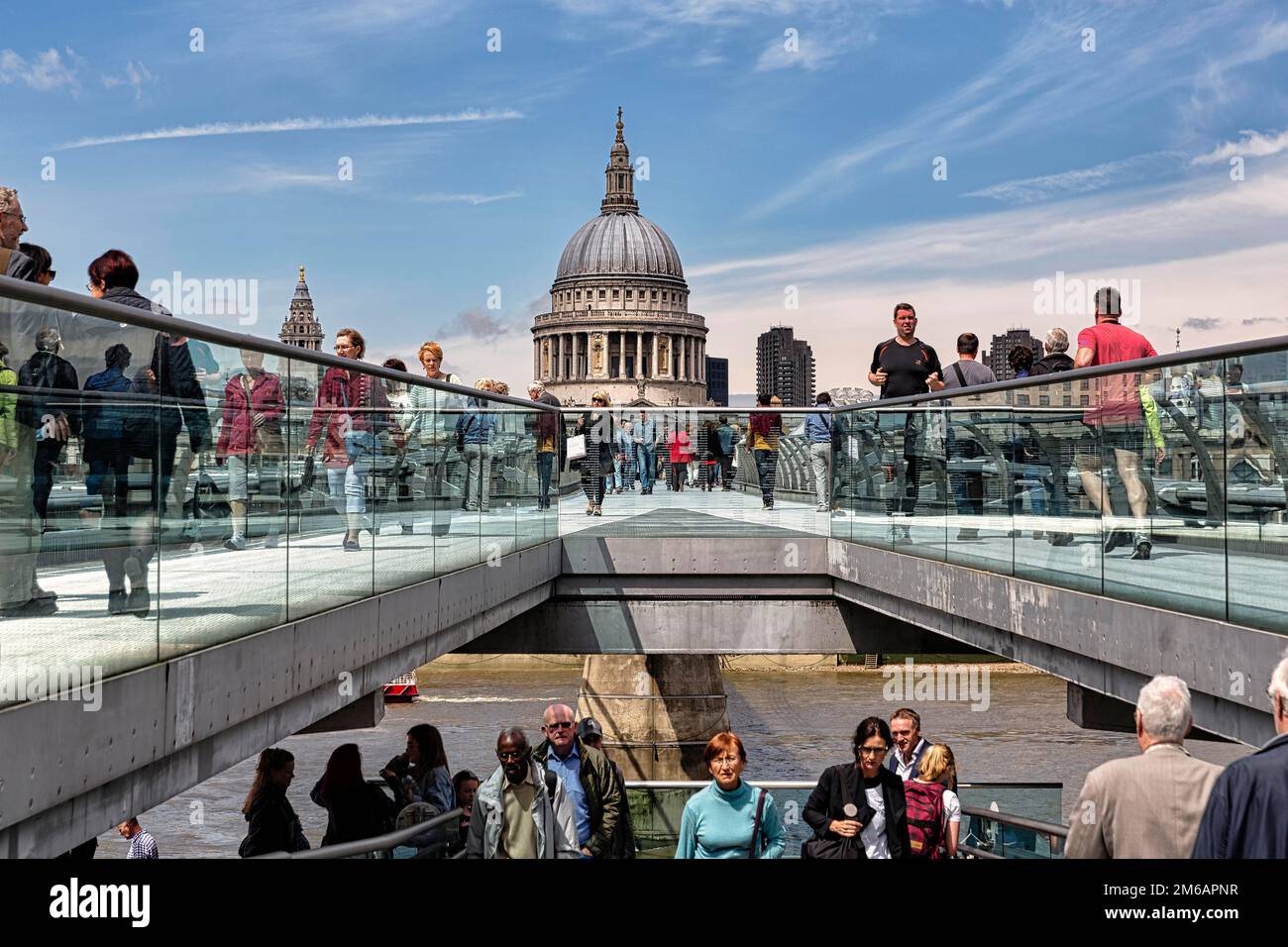 Crowd, passers-by on a bridge, Millennium Bridge overlooking St Pauls ...