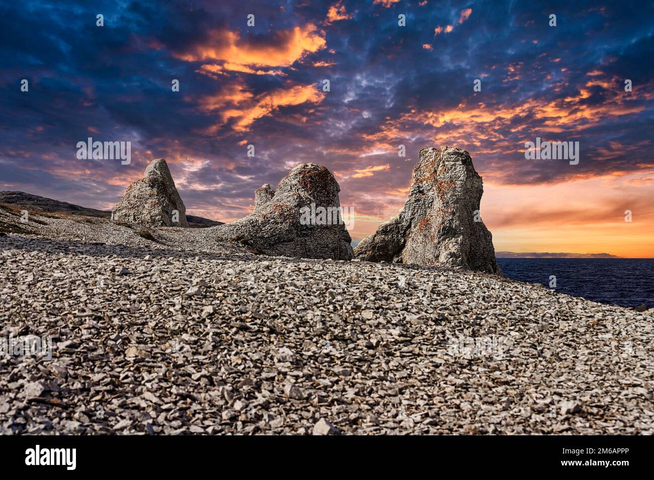 Dolomite rock pillars, petrified trolls, dramatic evening sky ...