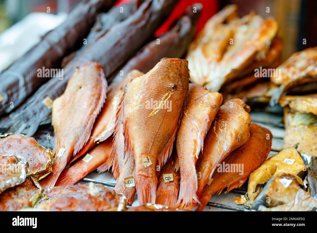 Selection of assorted home made smoked fish on a farmers market in ...
