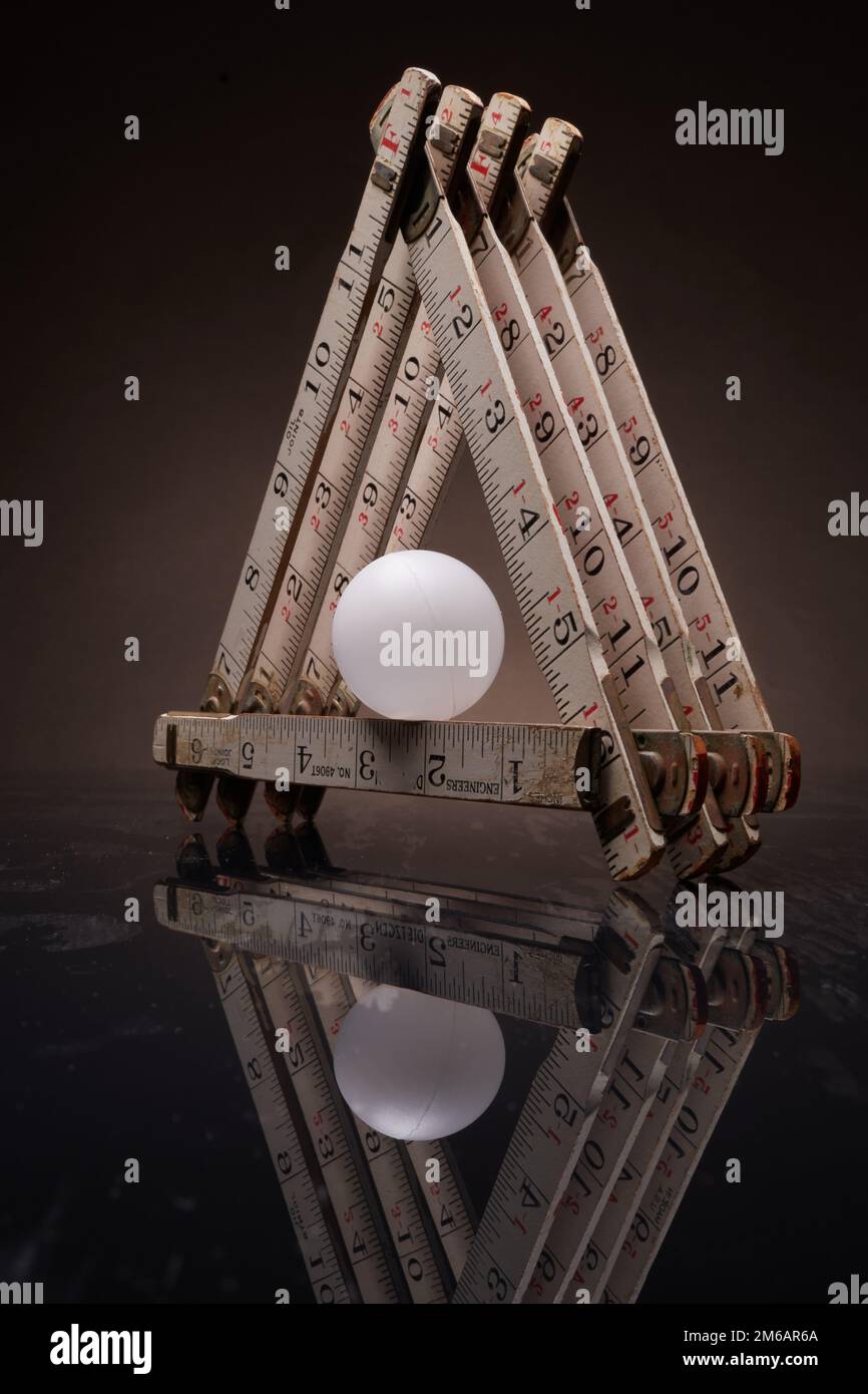 Antique carpenter's scale / measuring rule and sphere Stock Photo - Alamy