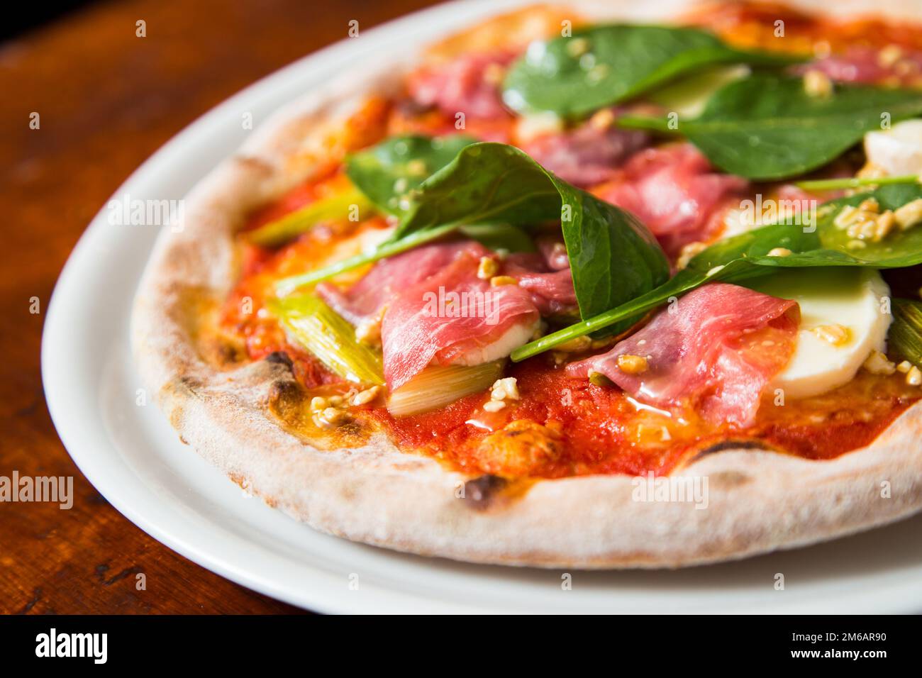 Pizza beef carpaccio. Neapolitan pizza made with tomato sauce, cheese ...