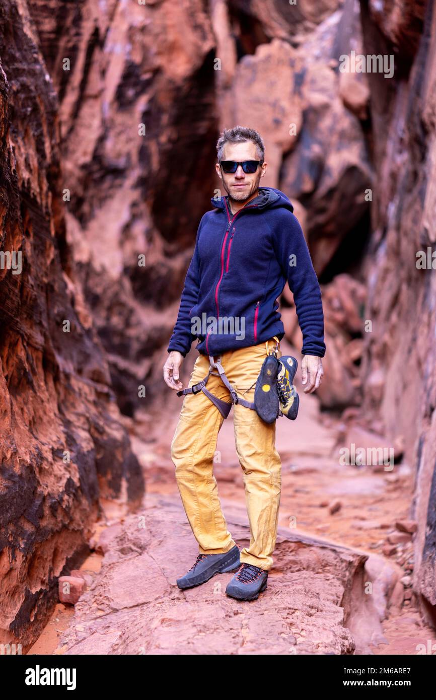 Strong happy climber in Red Rock canyon Stock Photo - Alamy