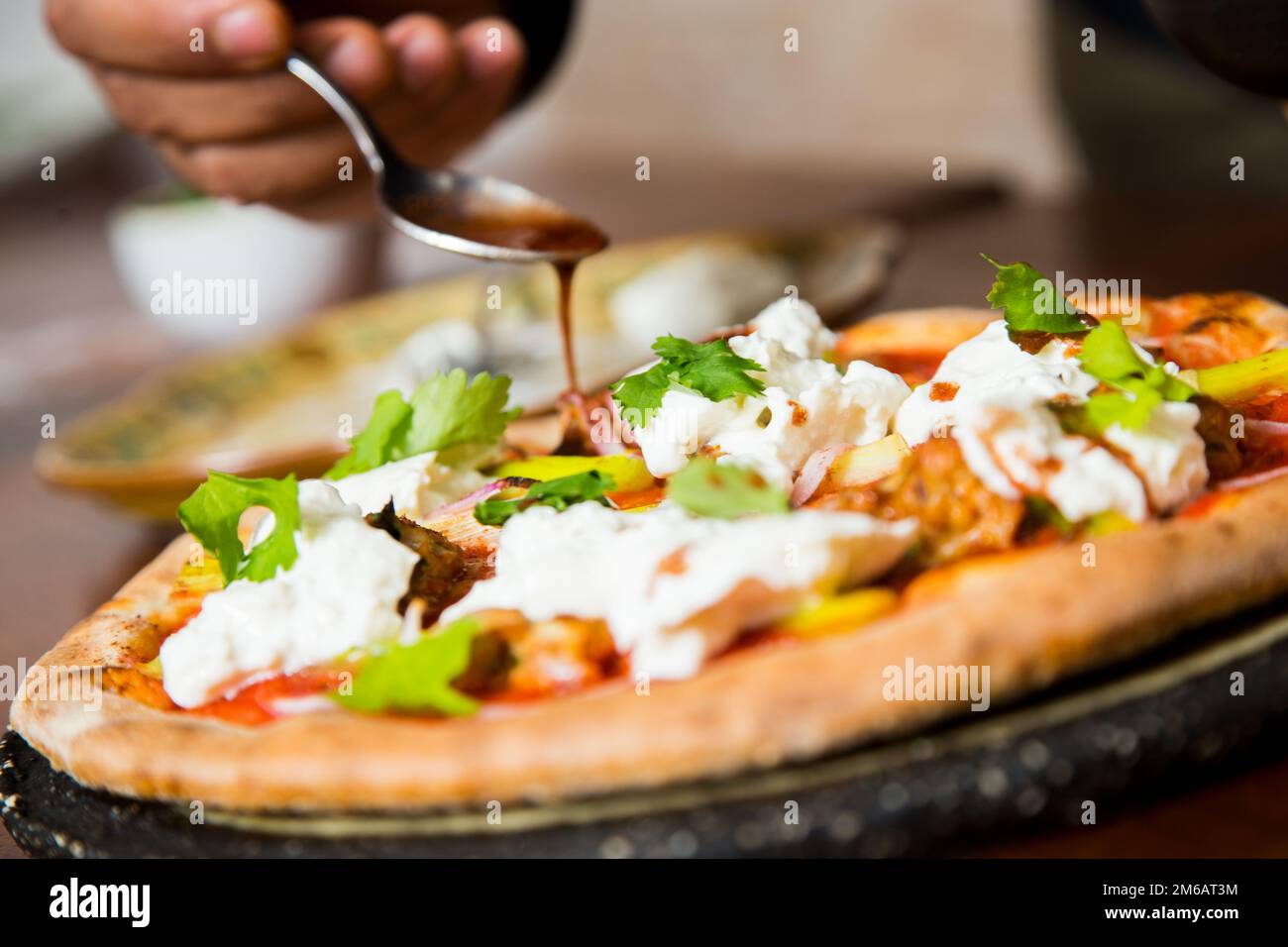 Pizza with meat and curry. Neapolitan pizza made with curry-spiced beef ...