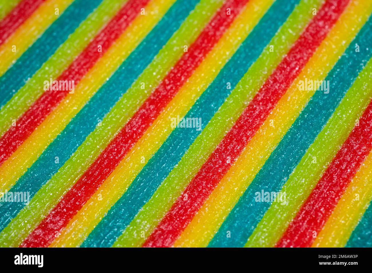 Background Of Rainbow Sour Jelly Candies Strips In Sugar Sprinkle Top