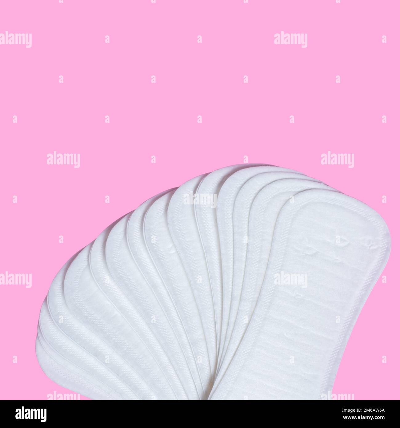 Feminine hygiene pads on a pink background. Concept of feminine hygiene ...