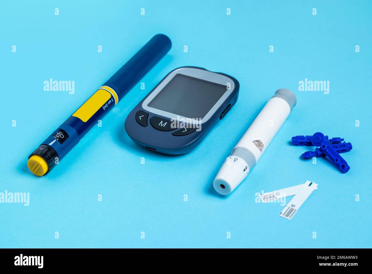 Measuring blood sugar. Glucometer, insulin pen, lancet and test strip ...